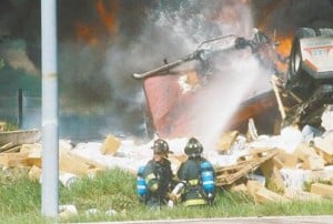 Semi crashes, bursts into flames