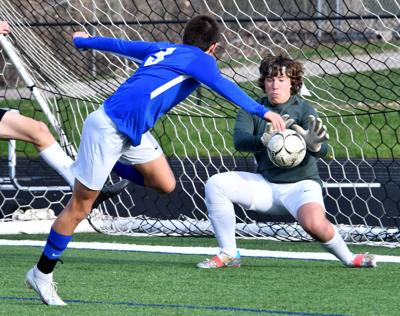 Prep boys soccer: Edwards, Sabers upend Blue Devils in OT