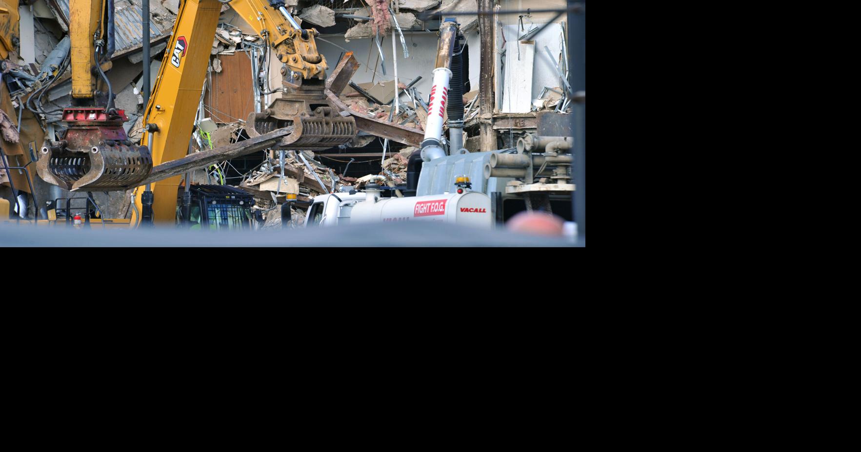 Photos: Search and rescue use industrial vacuum and a excavator claw ...