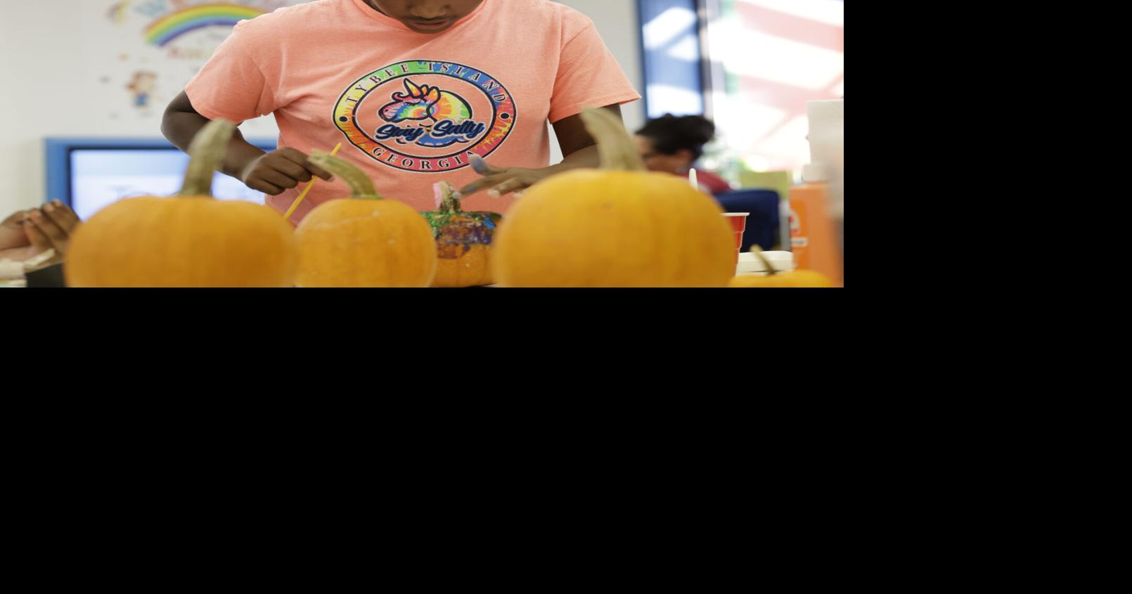 Autistic & Loved Halloween pumpkin decorating