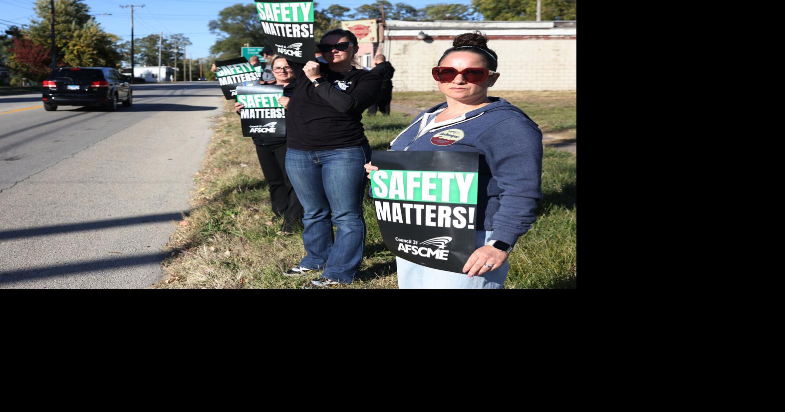 Union employees at East Moline Correctional Center picket