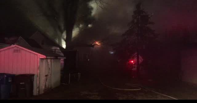 Moline firefighters battle a house fire early Saturday.