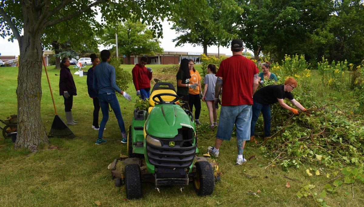 Students volunteer to clear invasive plants from the North High School ...