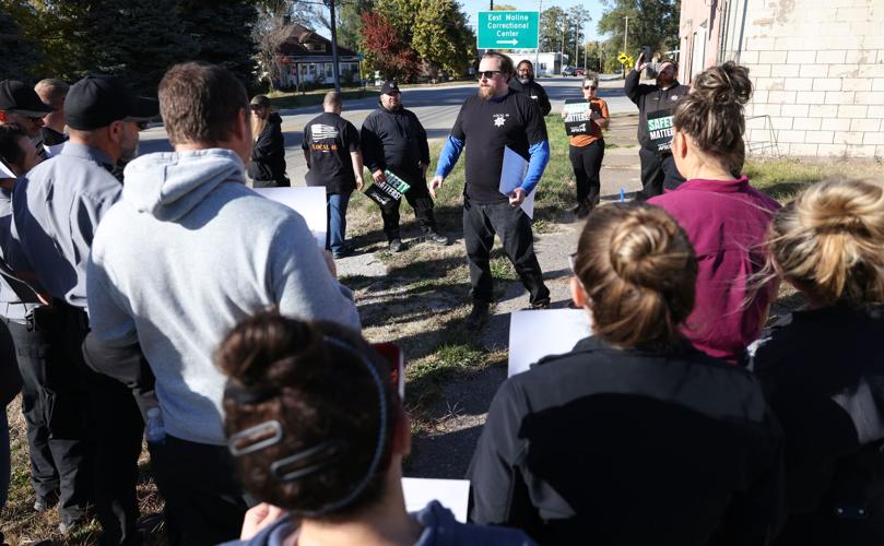 Union employees at East Moline Correctional Center picket