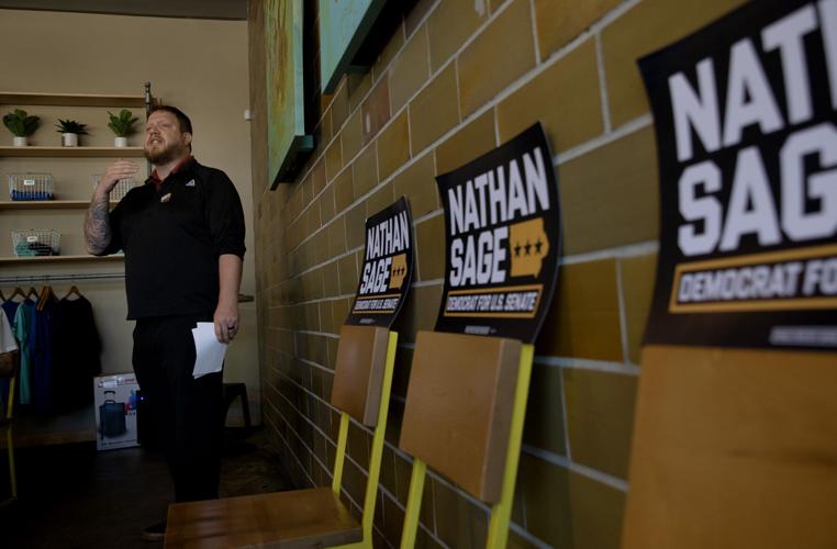 Democratic Senate candidate looks to tap into working Iowans’ anger