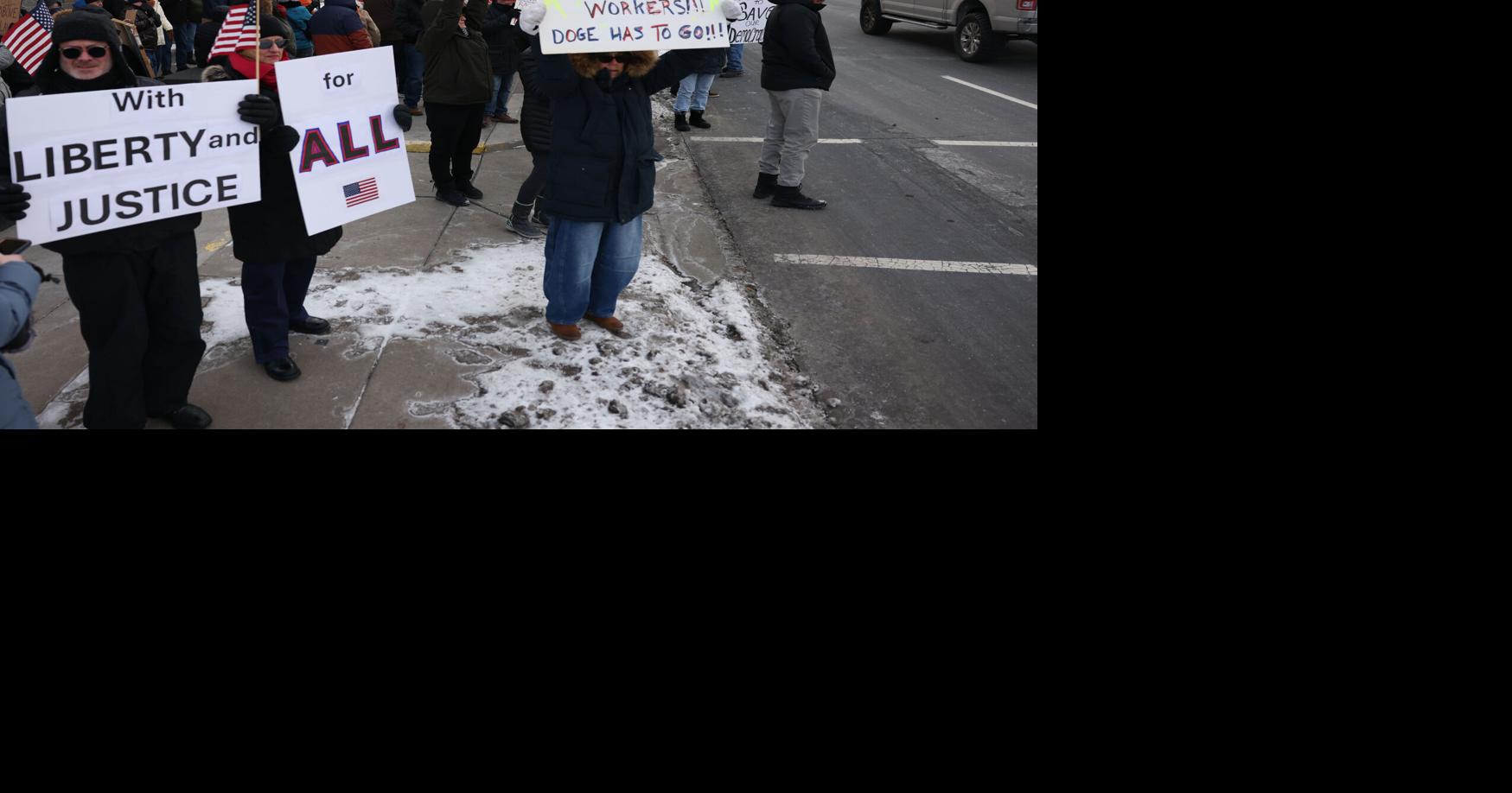 QC residents protest Trump at "Not my presidents day" rally