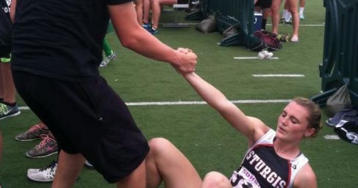 Siblings push each other on the track