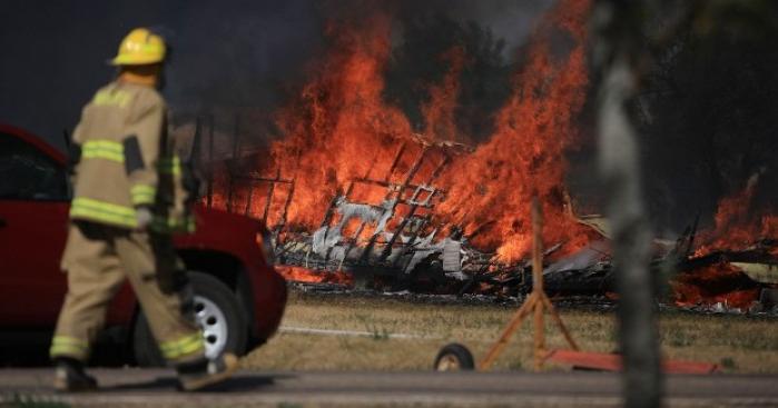 Rapid Valley fire burns two homes, wood shed