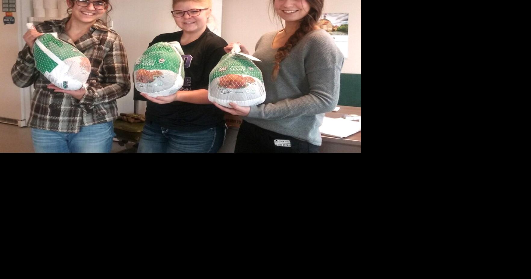 Students deliver turkeys for Compassion Cupboard