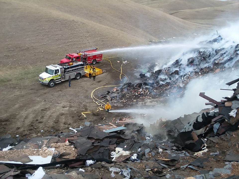 Rubble site fire may continue to smolder through weekend