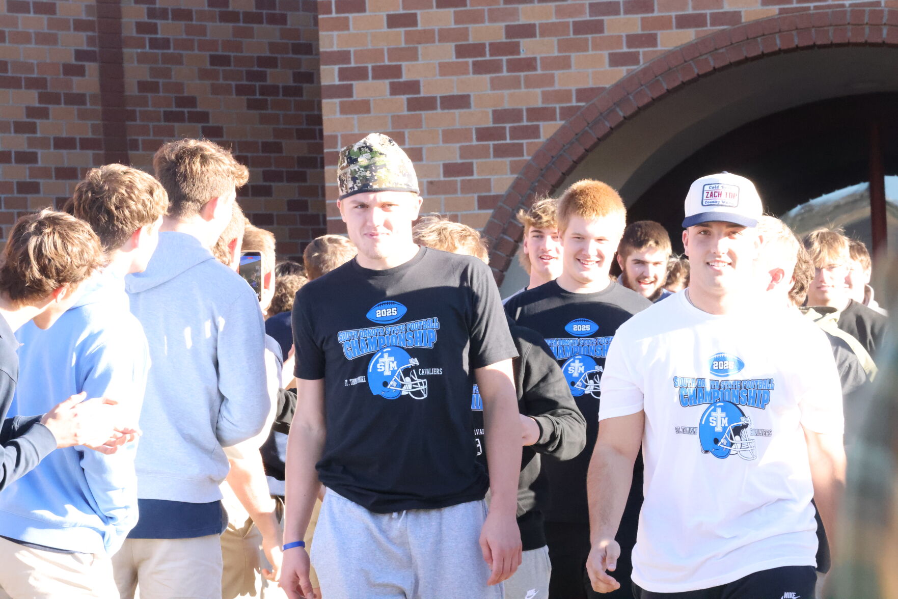 PHOTOS: St. Thomas More football departs for the DakotaDome