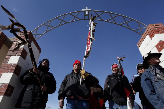 Gunfire, chants mark Wounded Knee anniversary
