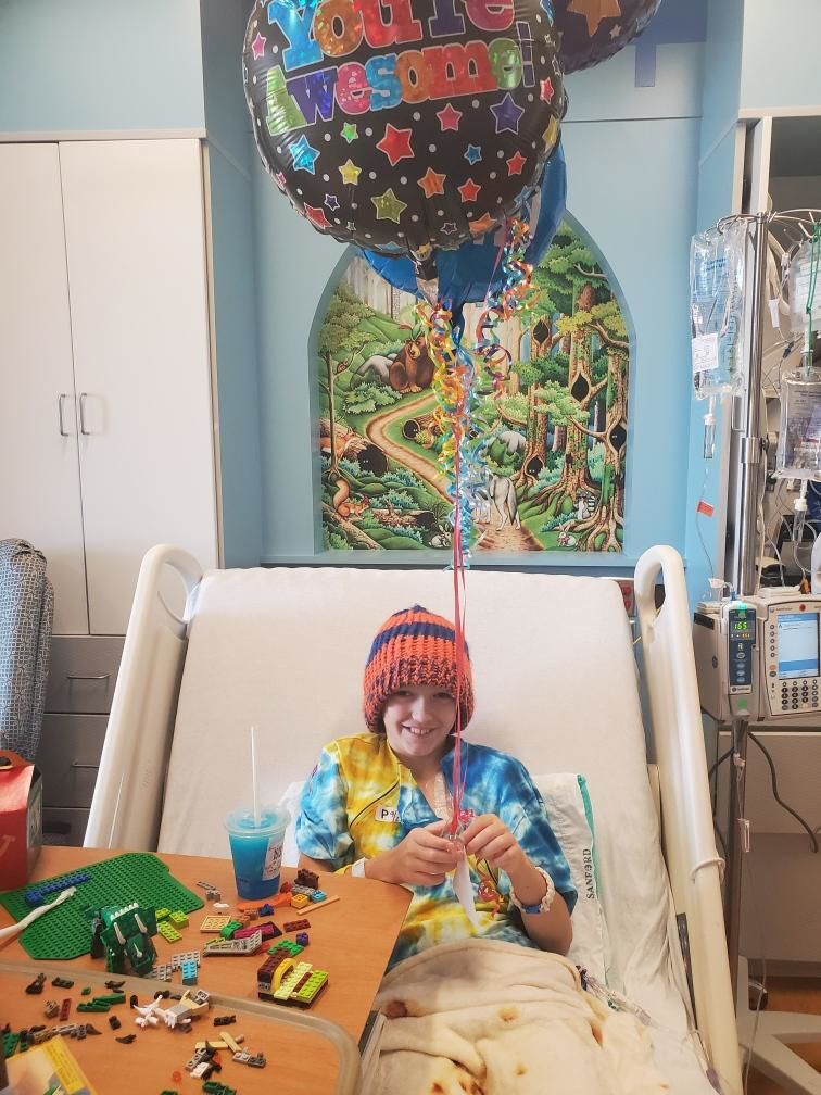 Young football player's cancer battle brings rivals together in Rapid City