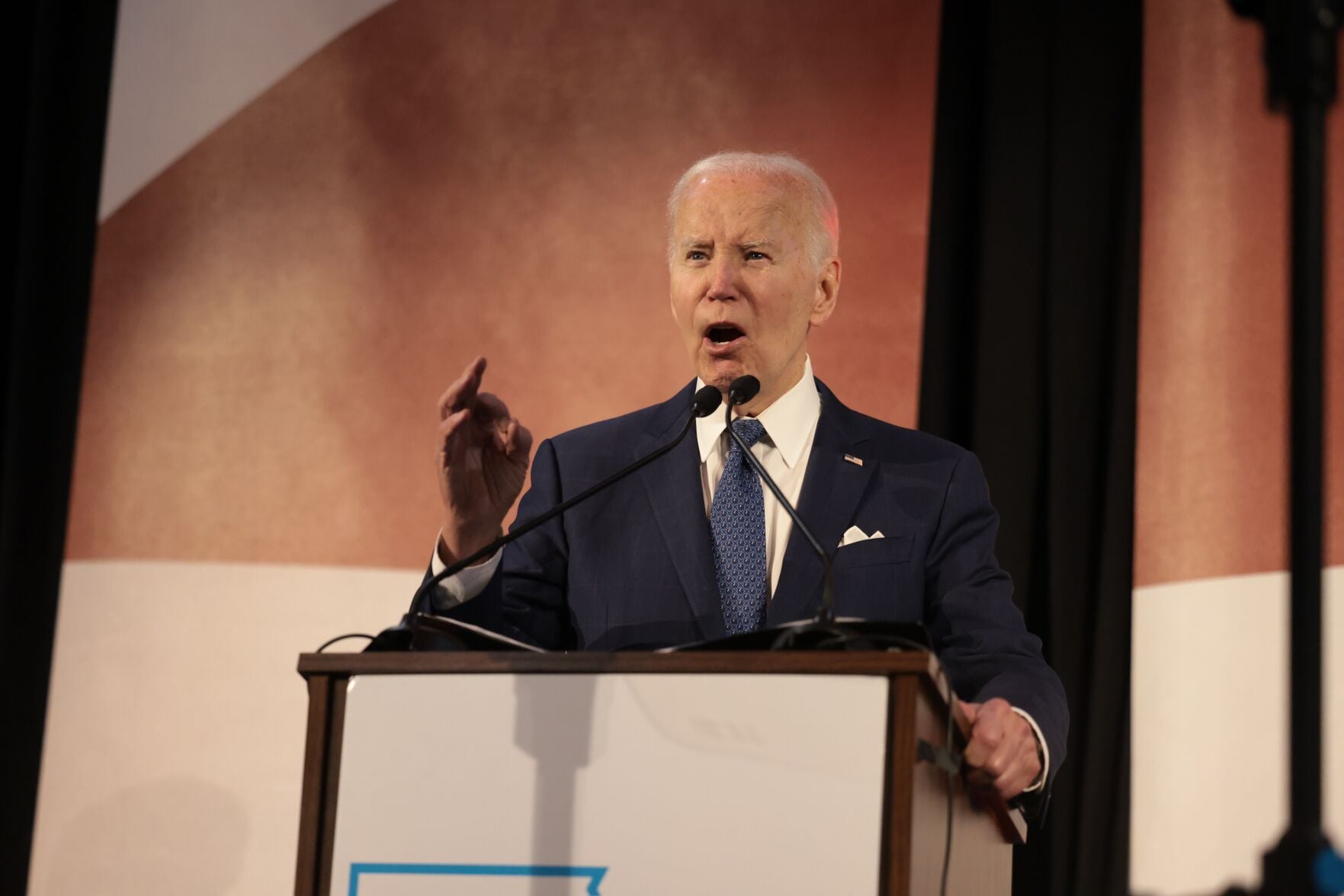 Former U.S. president Joe Biden takes the mic in Sioux Falls