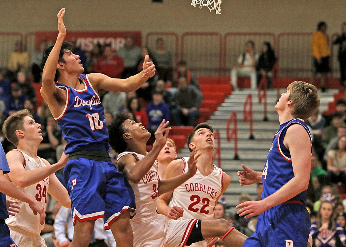 Rapid City Central trips Douglas in boys basketball action
