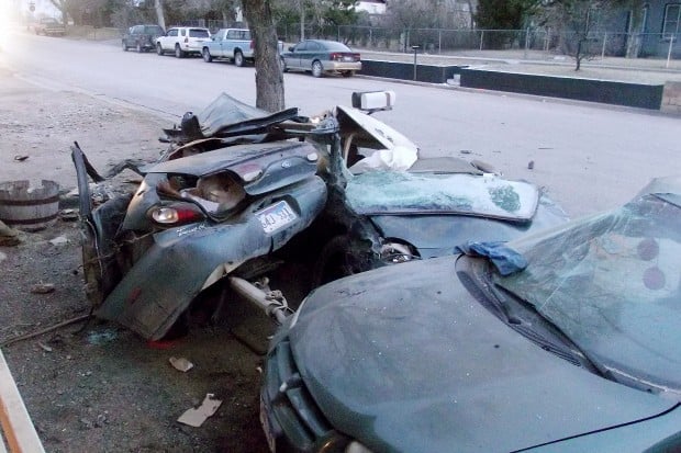 Three injured when car wraps around tree