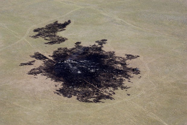Day after bomber crash, Ellsworth investigators swarm debris field