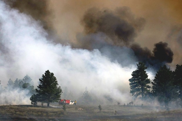 Fire had trapped firefighters in rugged canyon country