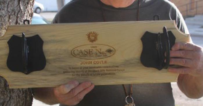 Coyle awarded plaque from BH National Forest