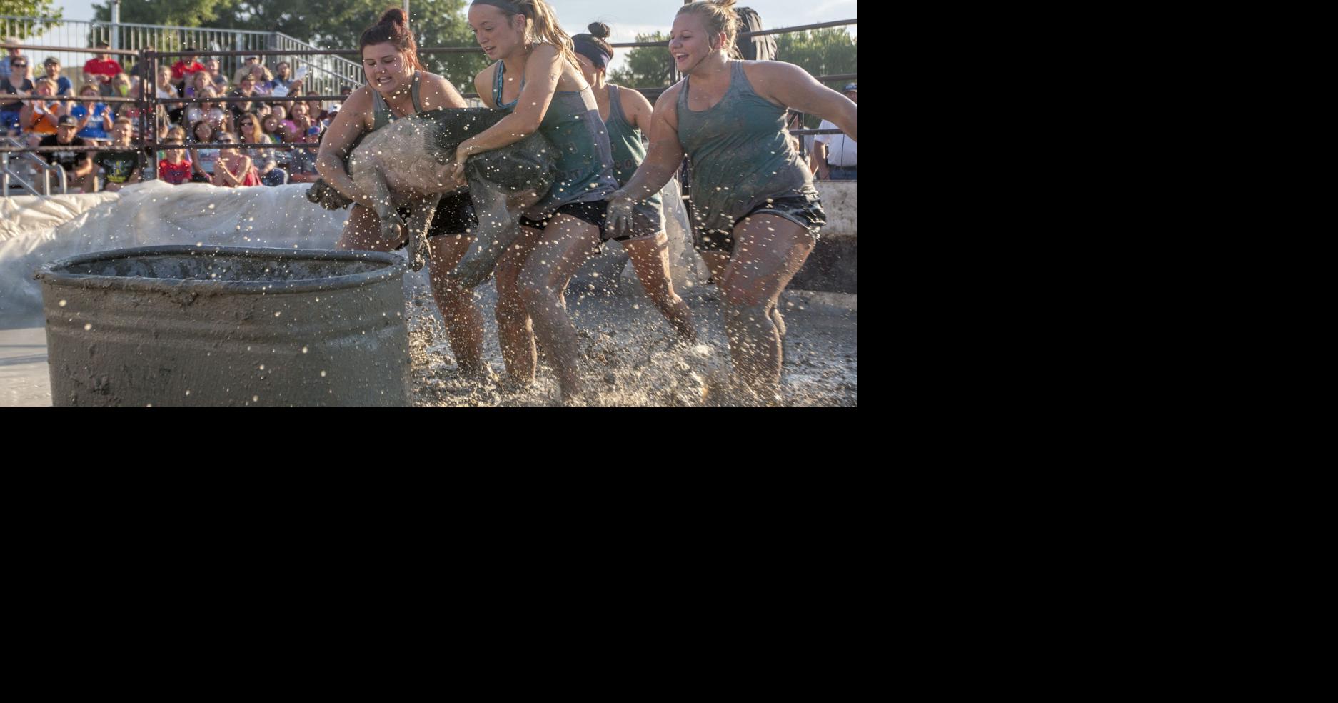 Pig wrestling winners bring home bacon for charities