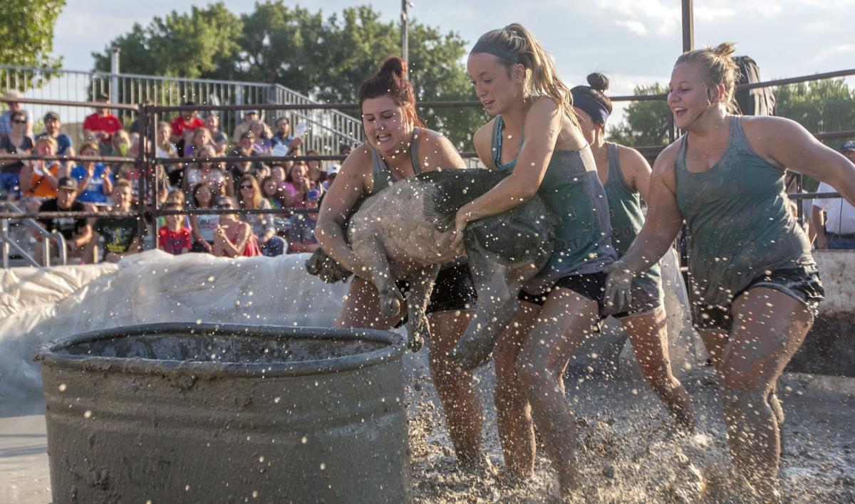 Pig wrestling winners bring home bacon for charities | Local ...