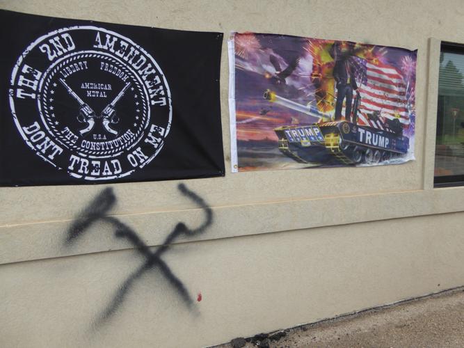 Trump Shop tagged with anti-Trump graffiti