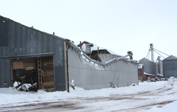 Snow causes roof of grain warehouse to collapse