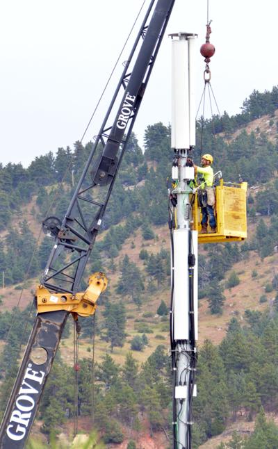 Workers make repairs on downtown cell tower