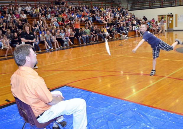 Middle school students throw pie at staff for fundraiser