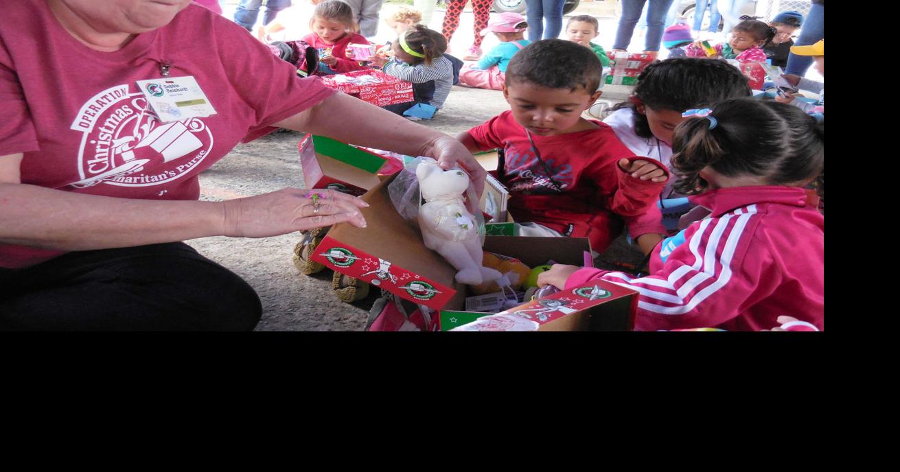 Operation Christmas Child volunteer delivers shoeboxes