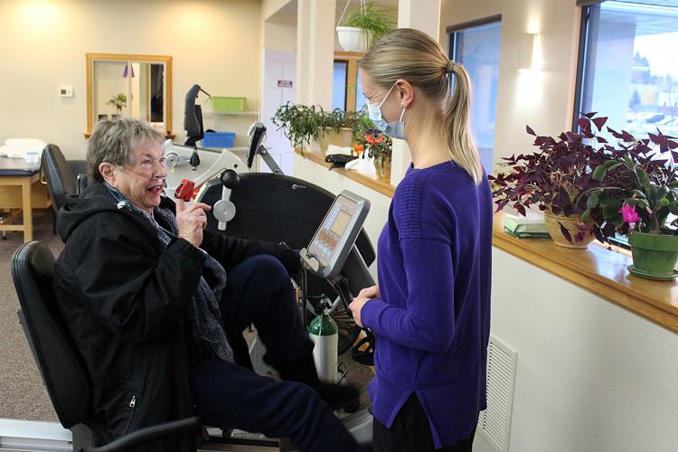 Physical Therapist specializing in cardio pulmonary gives patients ...