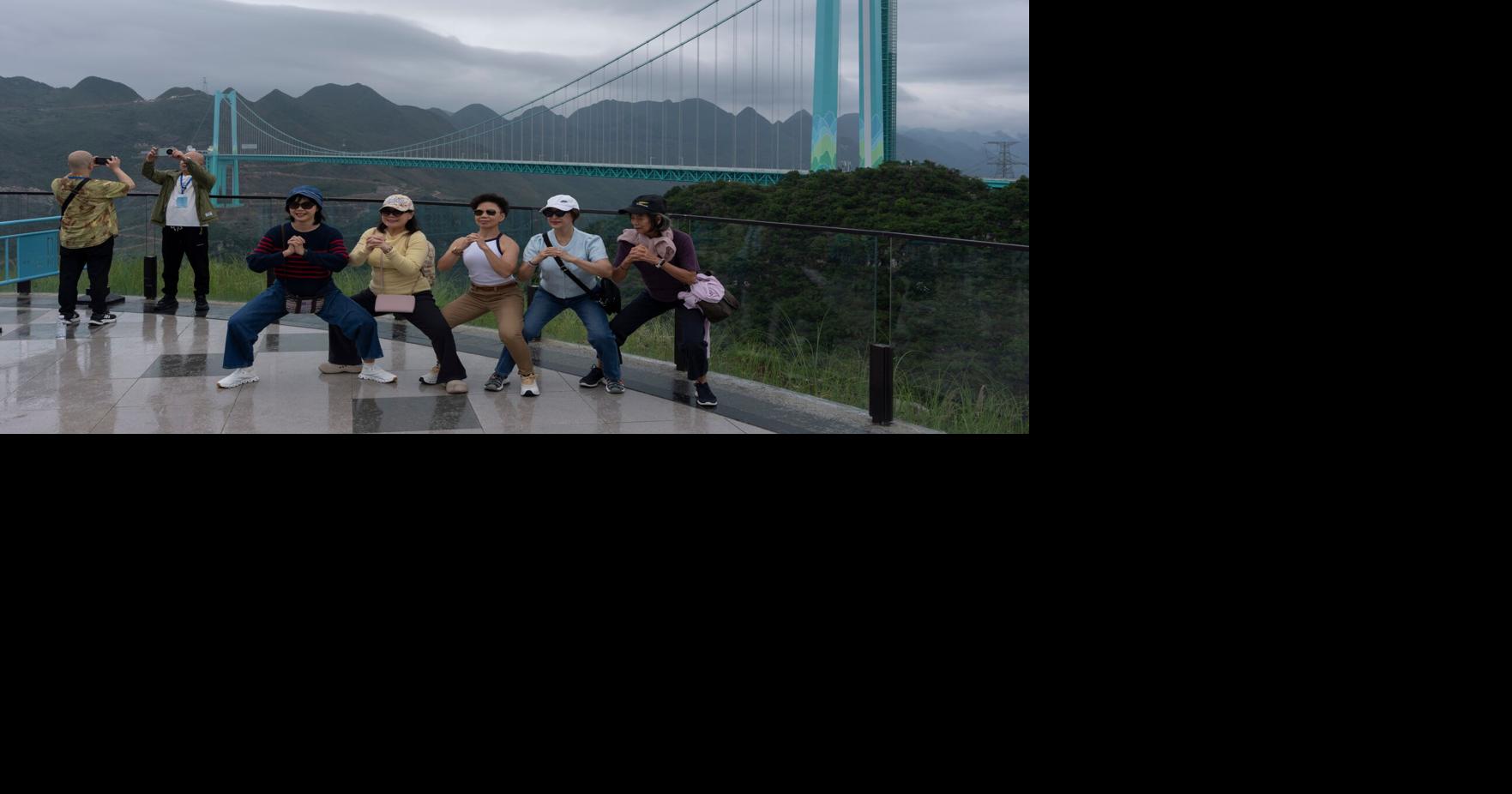 China’s highest bridge brings tourists and internet access to remote ...