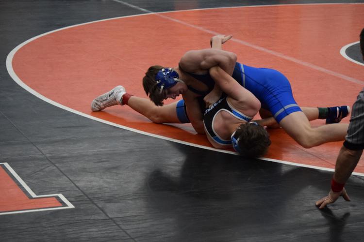 Reynolds dominates as they claim 22nd District 10 team wrestling title ...