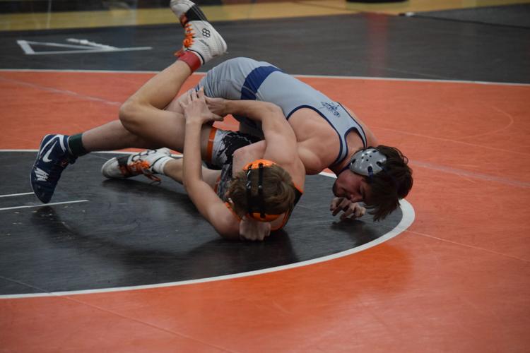 Reynolds dominates as they claim 22nd District 10 team wrestling title ...