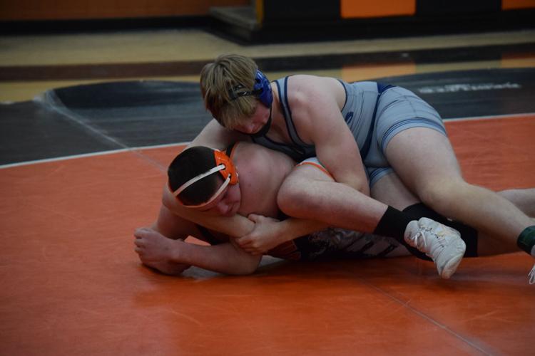 Reynolds dominates as they claim 22nd District 10 team wrestling title ...