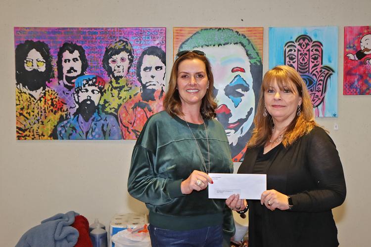 Newspaper donates to animal wellness center | News | register-herald.com