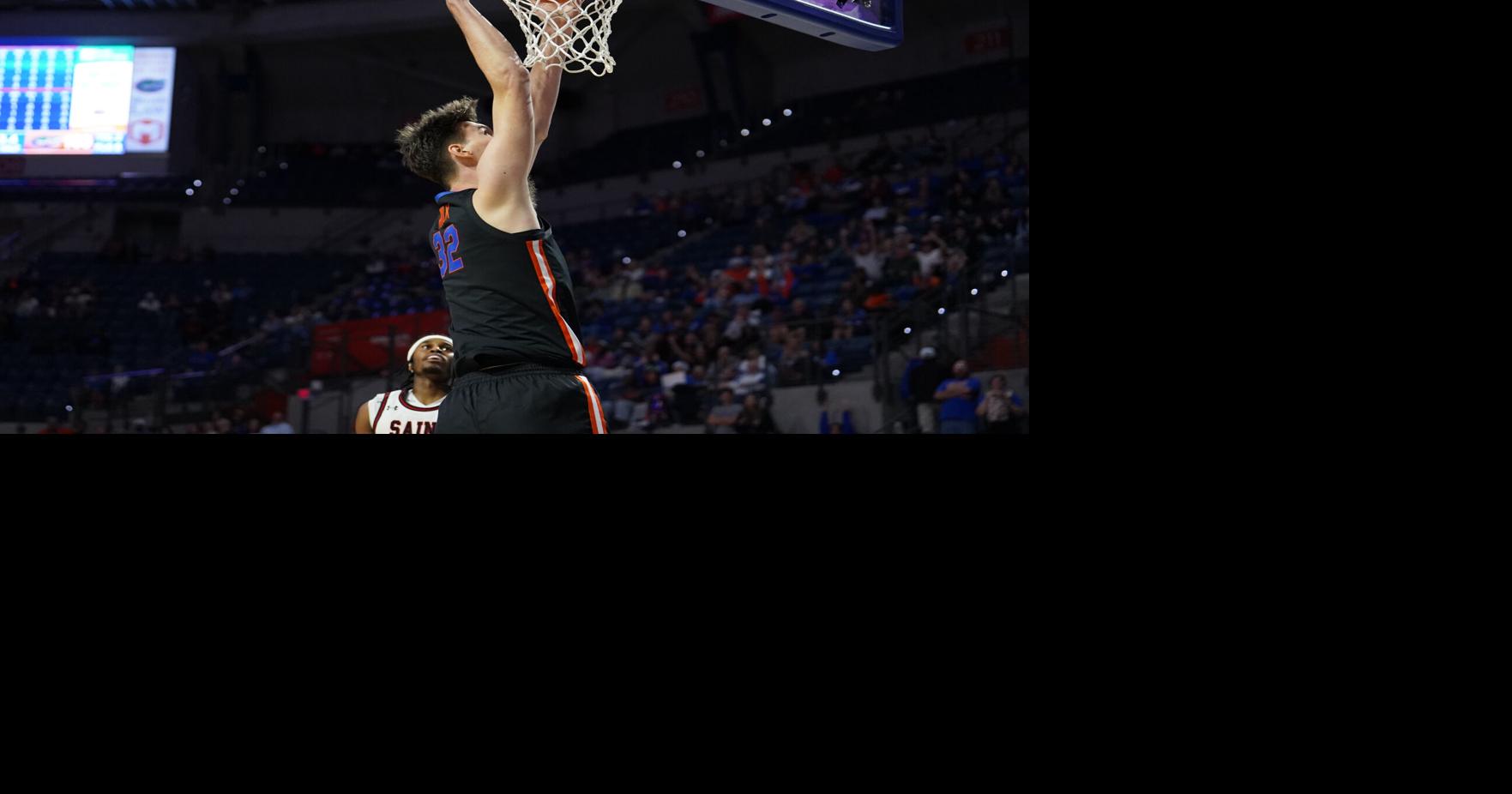 World's tallest teen, Florida's Olivier Rioux, delivers emphatic dunk ...