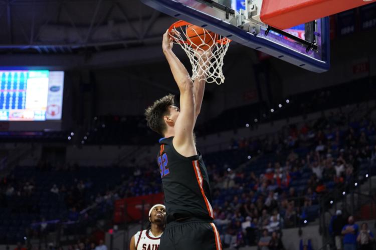 World's tallest teen, Florida's Olivier Rioux, delivers emphatic dunk ...