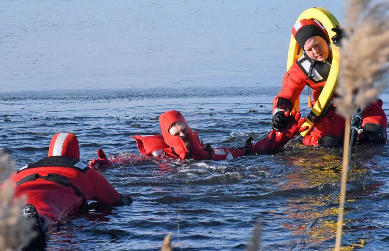 Cold-water rescue training sends firefighters into frozen pond | News ...