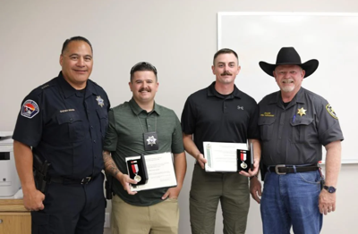 Two sheriff's deputies recognized for saving injured motorcyclist ...