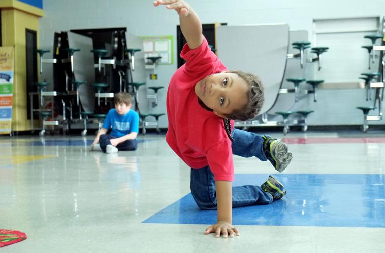 Students learn yoga at YMCA’s spring break camp | Local News ...