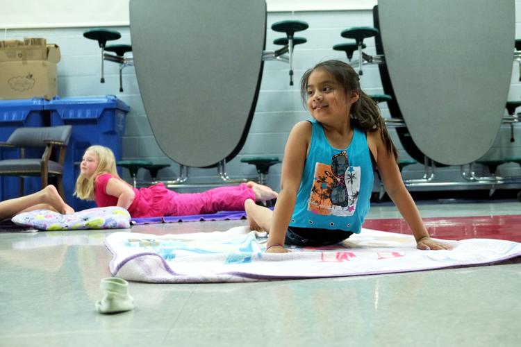 Students learn yoga at YMCA’s spring break camp | Local News ...