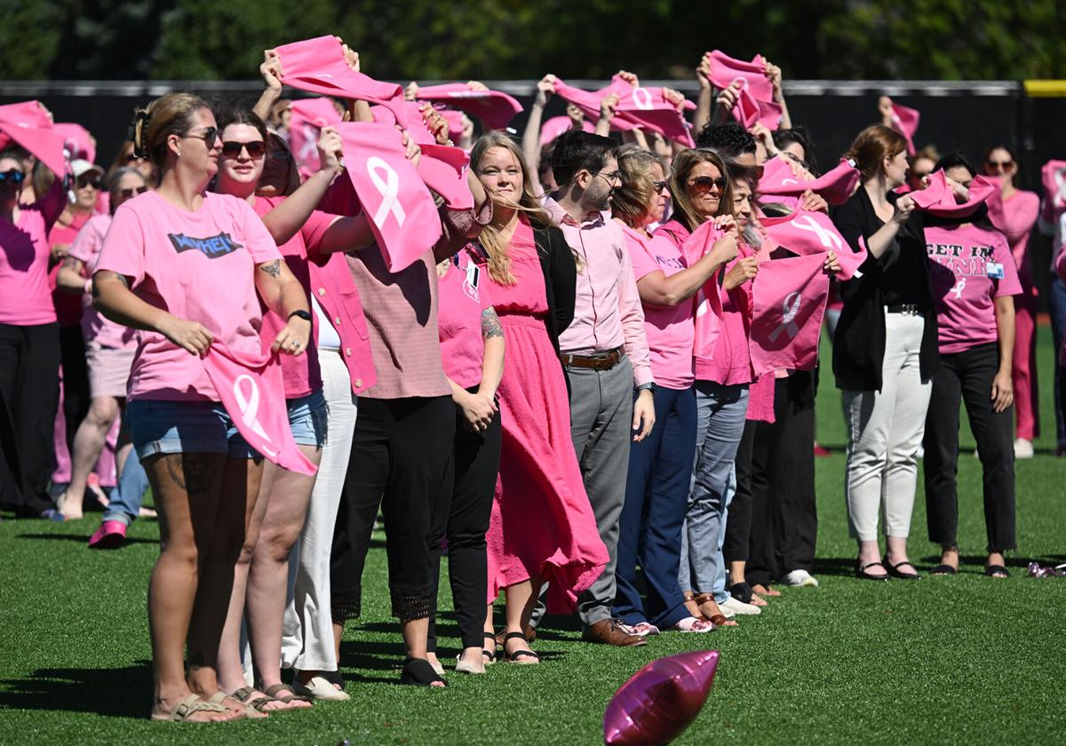 SENTINEL SNAPSHOT: Human pink ribbon promotes breast cancer awareness ...