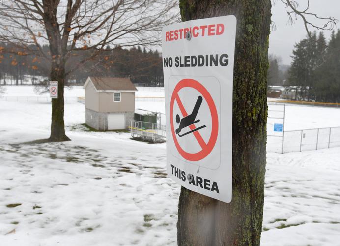 No sledding signs return along with snow at Lee Town Park | News ...