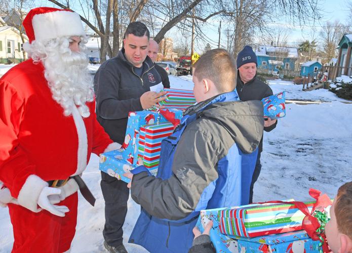 Firefighters help deliver holiday cheer for four families | News ...