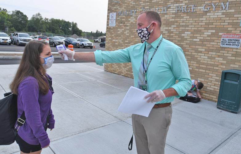 New school year begins with temp checks, social distancing | News ...