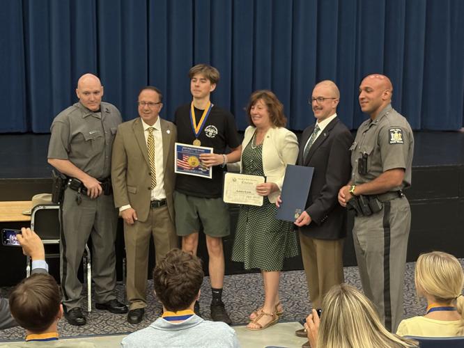 Students receive medals for helping save family from fire | News ...