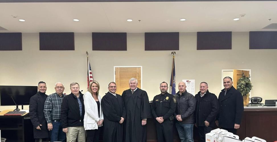 Newly-appointed New Hartford Town Justice David Longeretta is sworn in ...