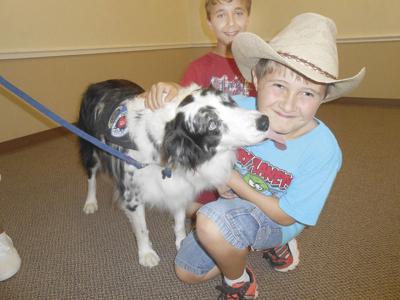 Therapy dogs are a hit at reading program | News ...
