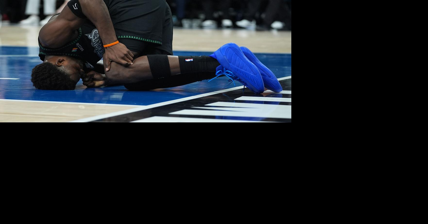 Wolves' Anthony Edwards has bone bruise in left knee and is likely to ...